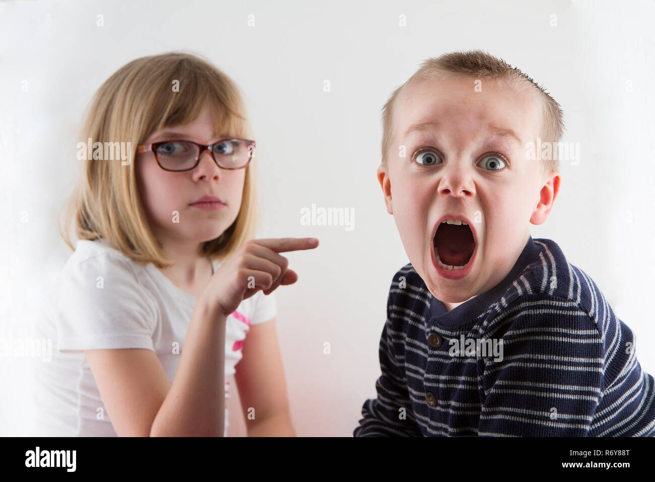 young girl pointing at a boy Stock Photo - Alamy