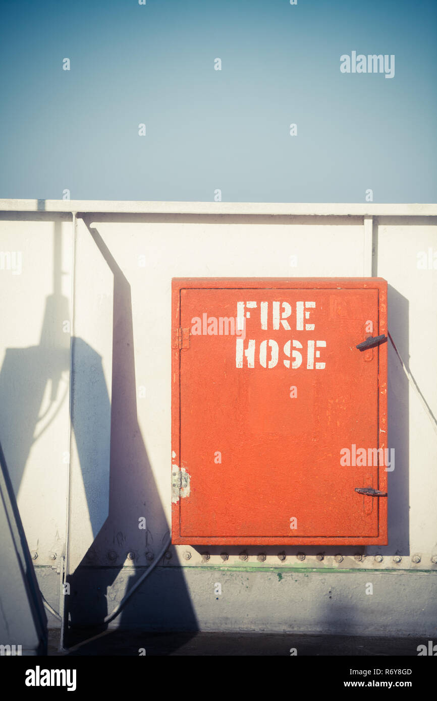 Fire hose on a ship Stock Photo - Alamy