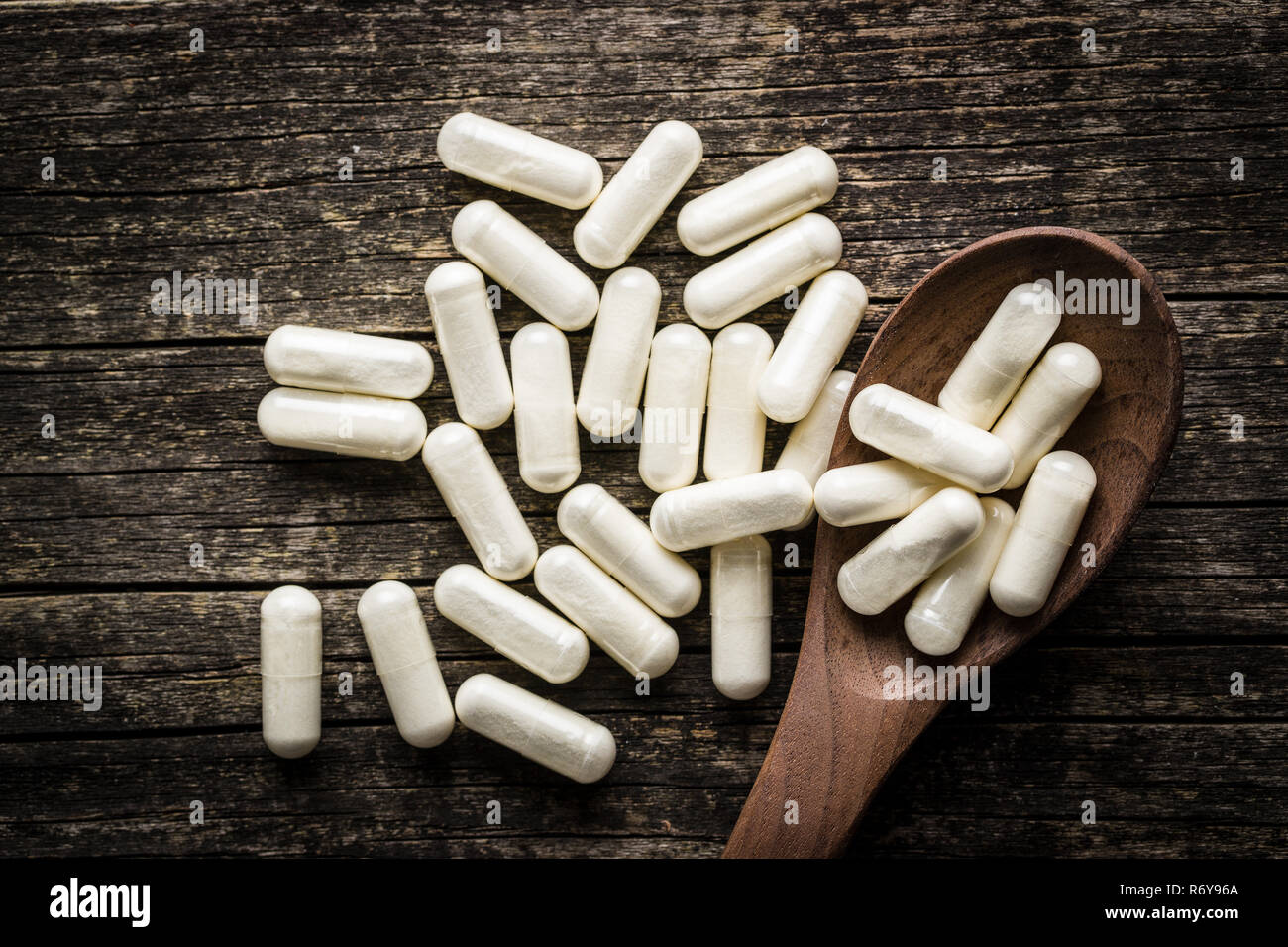 White medicine capsules Stock Photo - Alamy