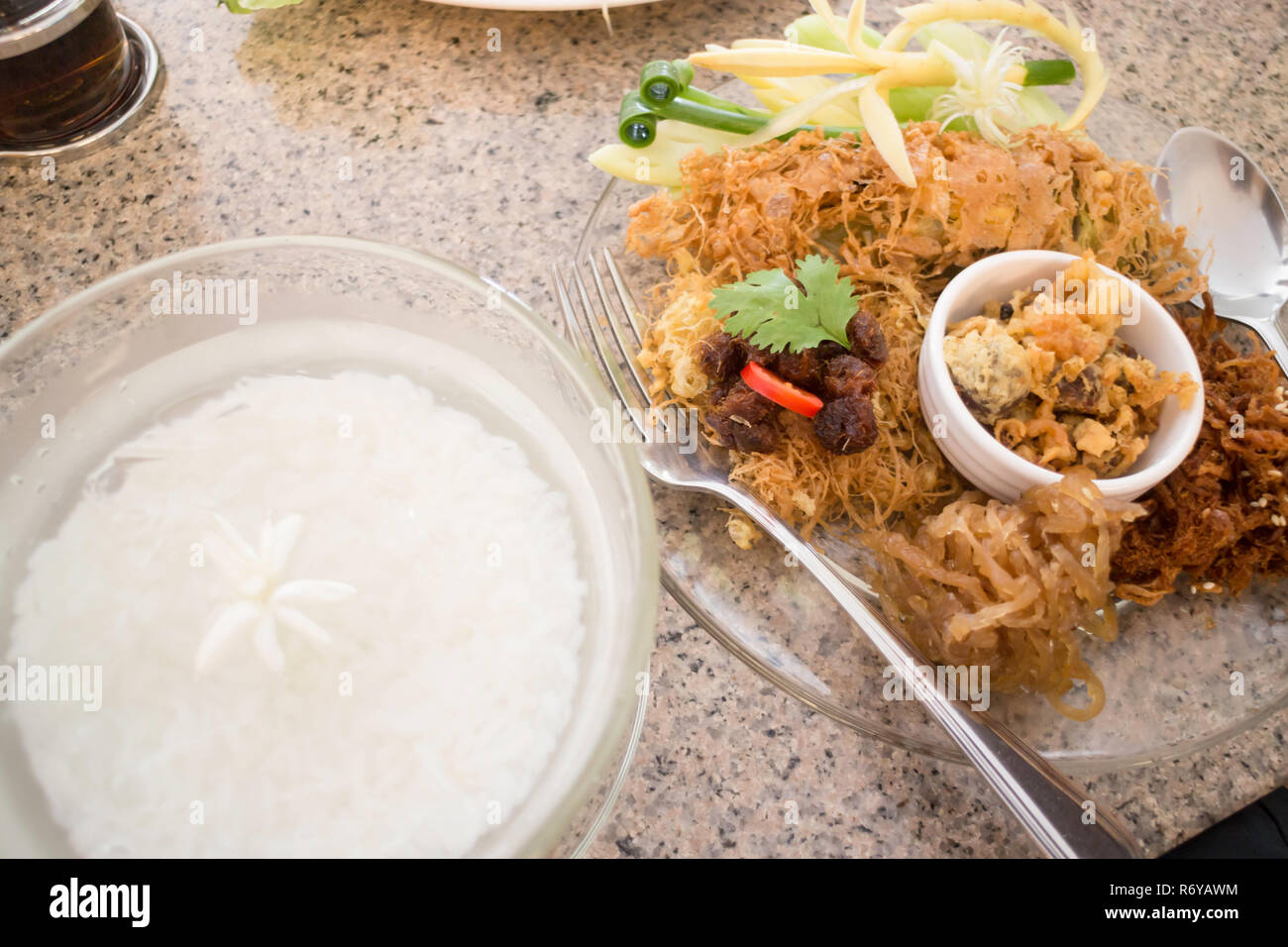 Rice in ice water thai food Stock Photo - Alamy
