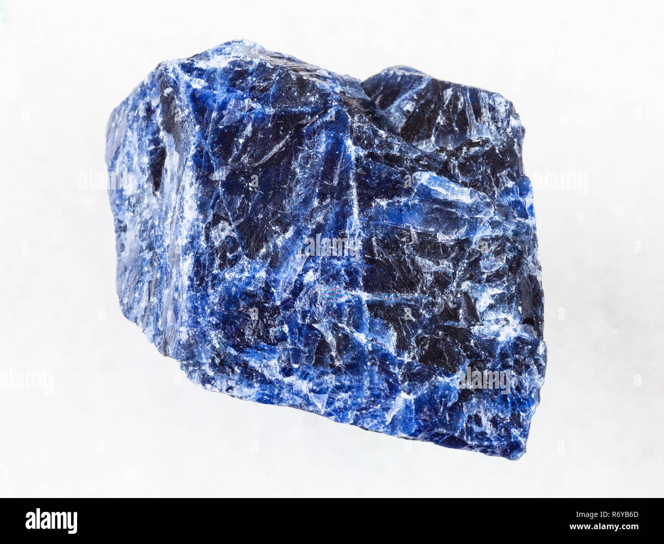 rough Sodalite stone on white Stock Photo - Alamy