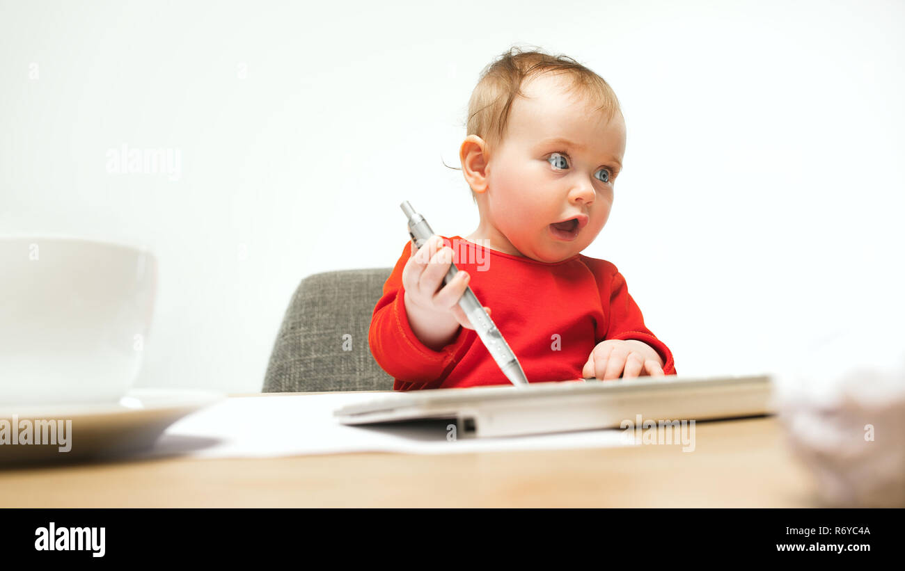 Happy child baby girl toddler sitting with keyboard of computer ...