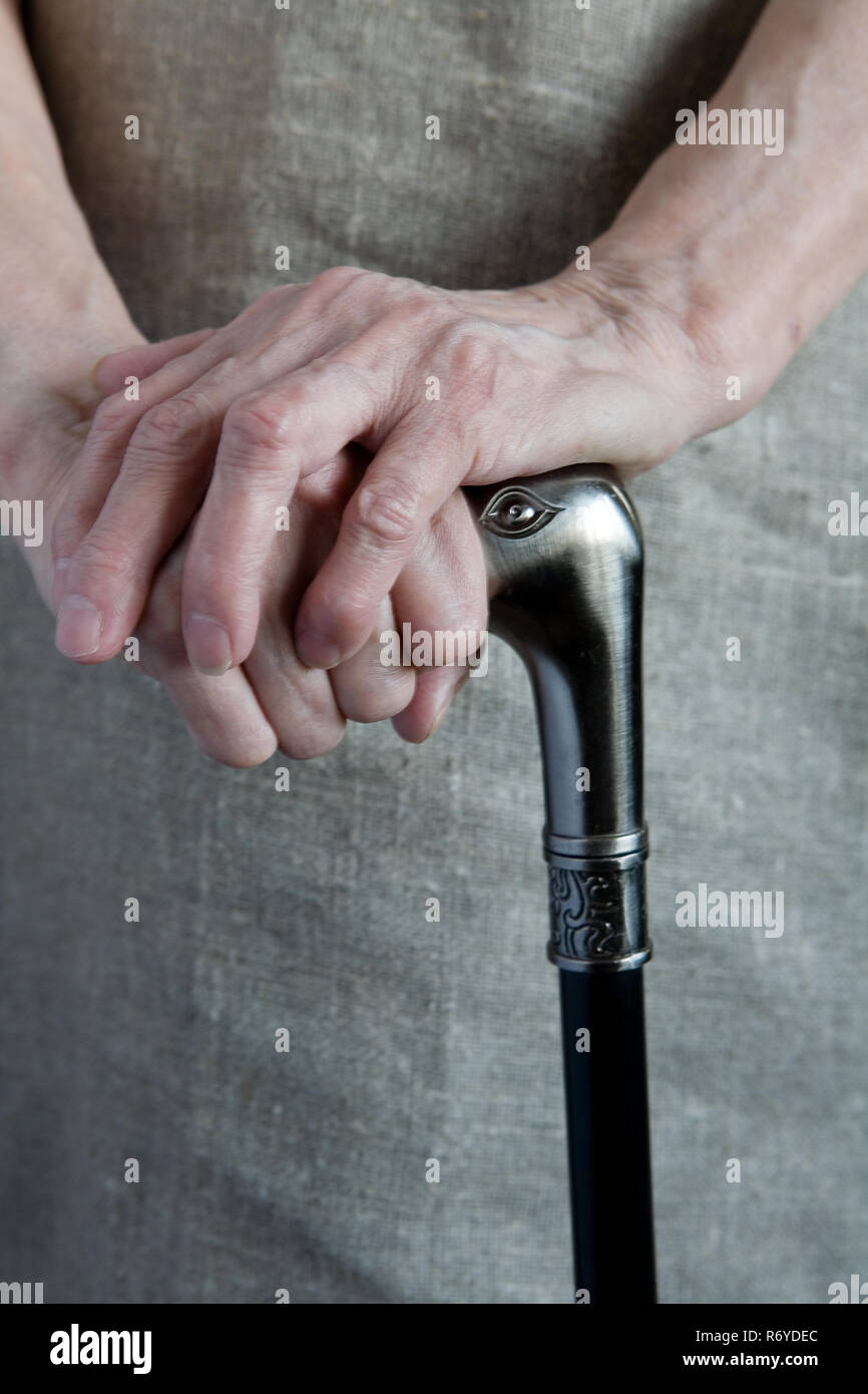 Woman holding a cane hi-res stock photography and images - Alamy