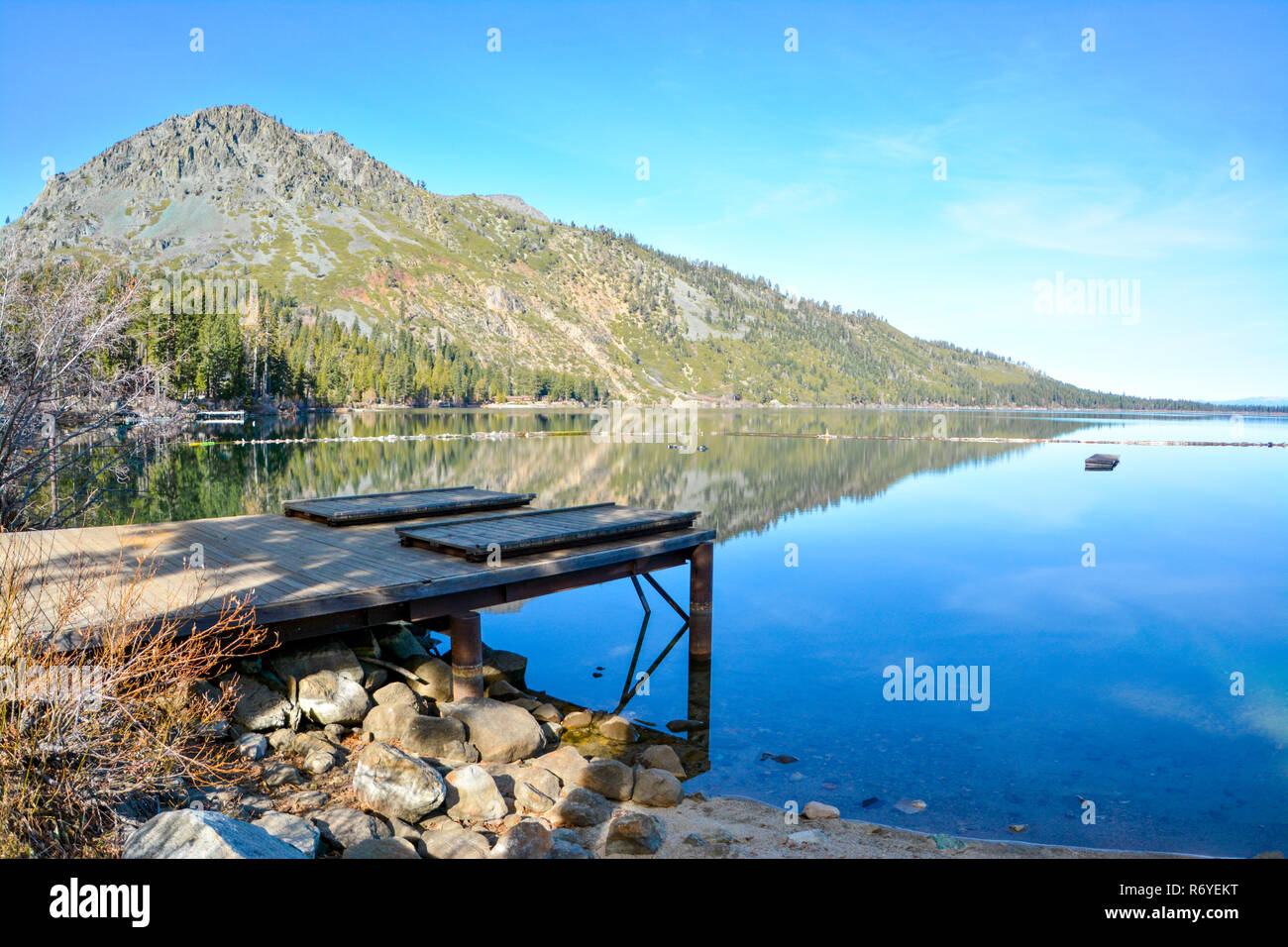 Fallen Leaf Lafe with pier and mountain in the back Stock Photo - Alamy