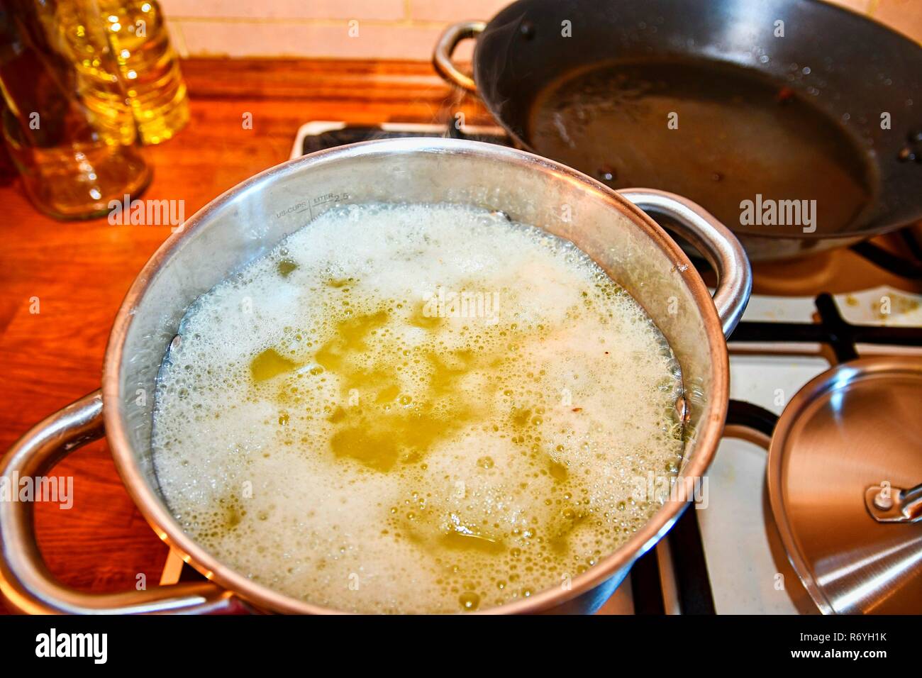 Cut potatoes boiling in stainless cooking pot. Cooking potatoes Stock ...