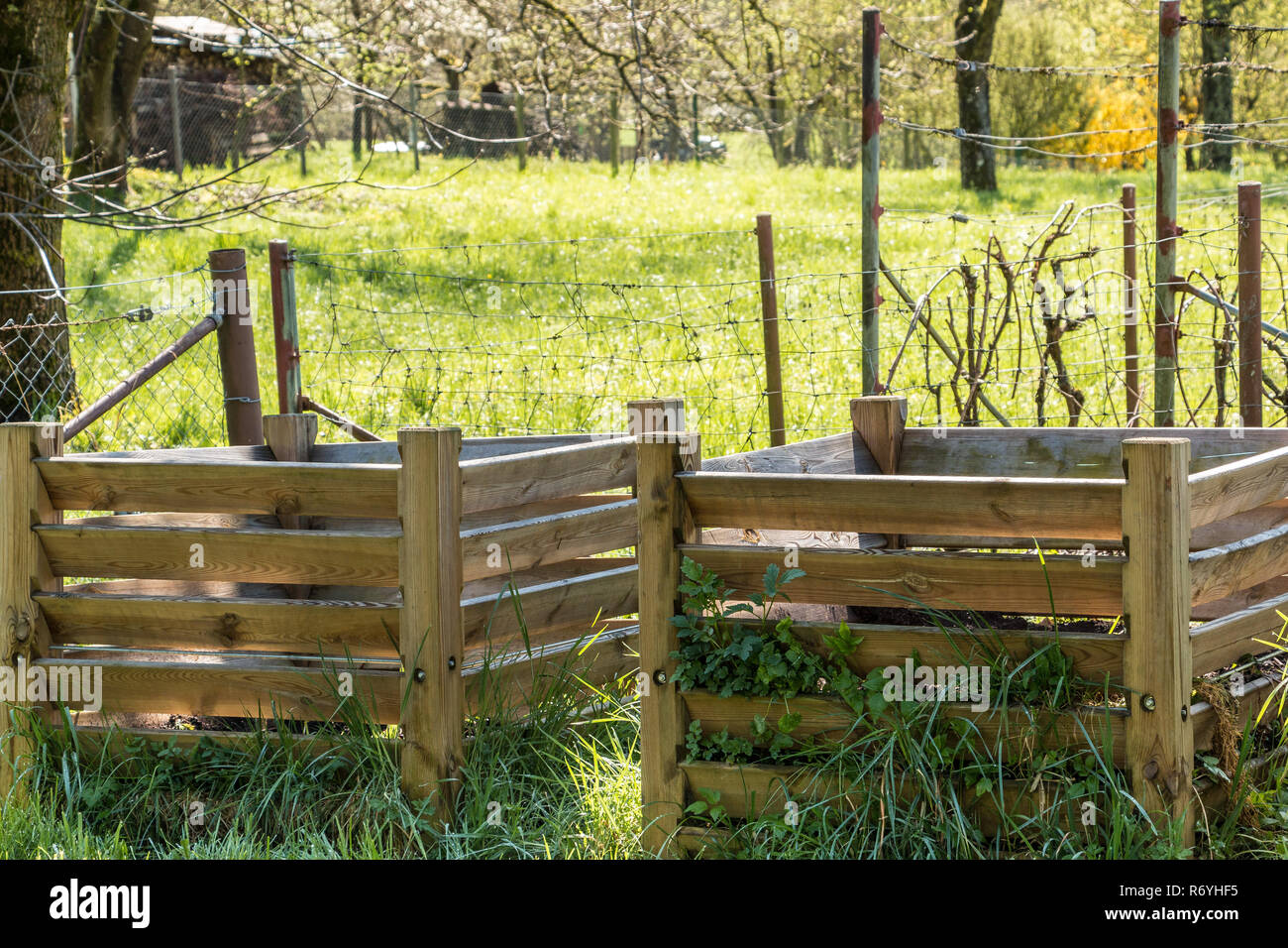 compost heaps with fertile soil in the green garden Stock Photo - Alamy