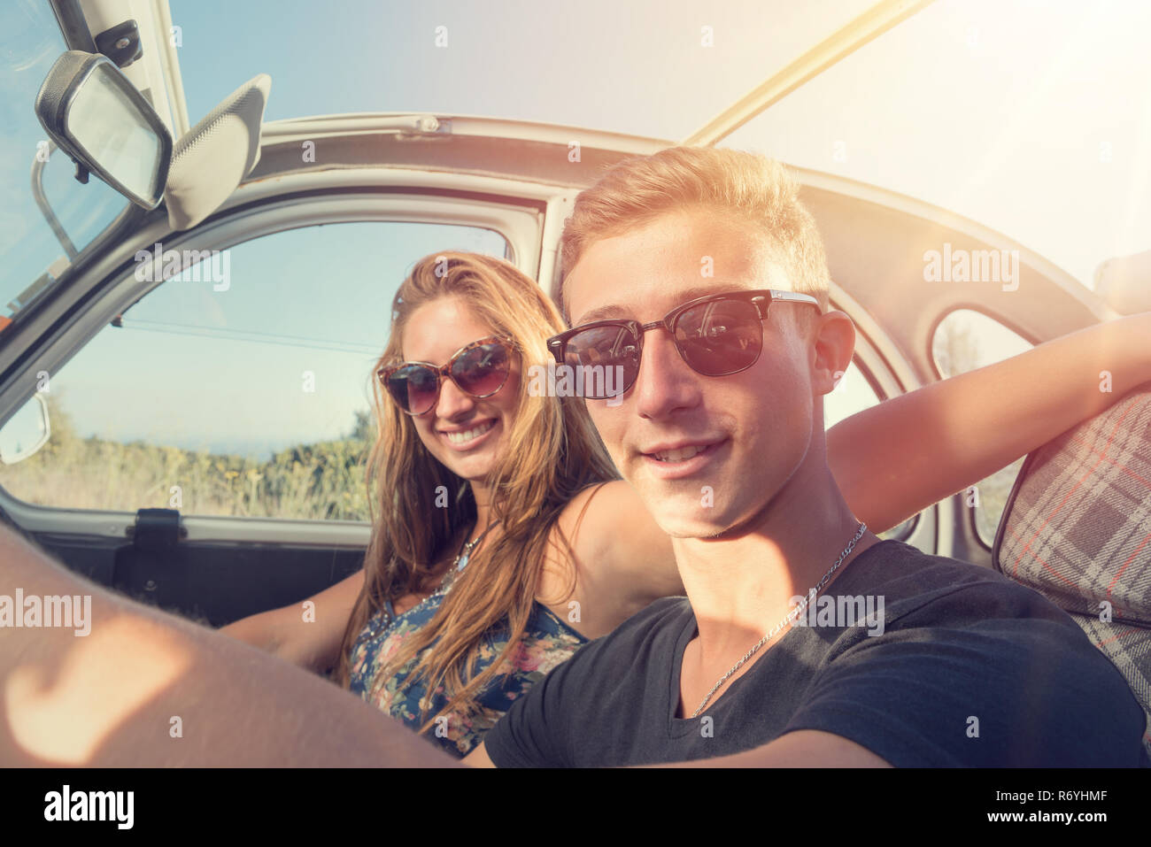 Couple in a car Stock Photo - Alamy