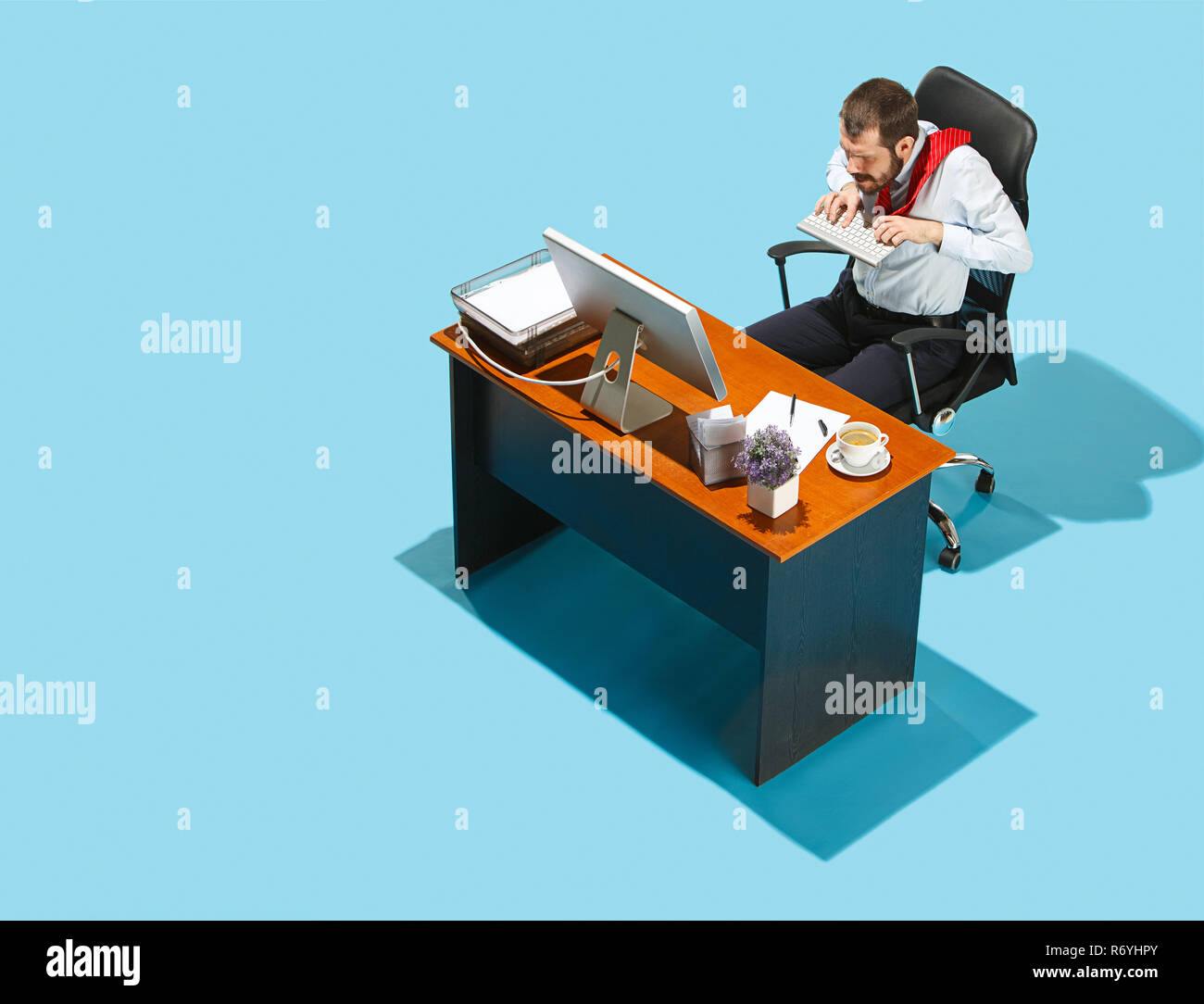 Shot from above of a stylish business man working on a laptop Stock ...