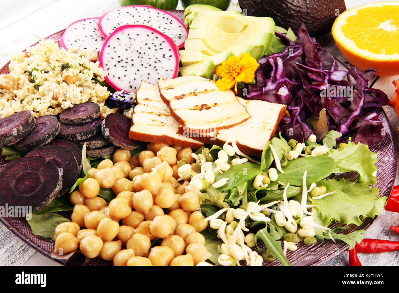 grilled tofu and dragon fruit buddha bowl with vegetable and humus ...