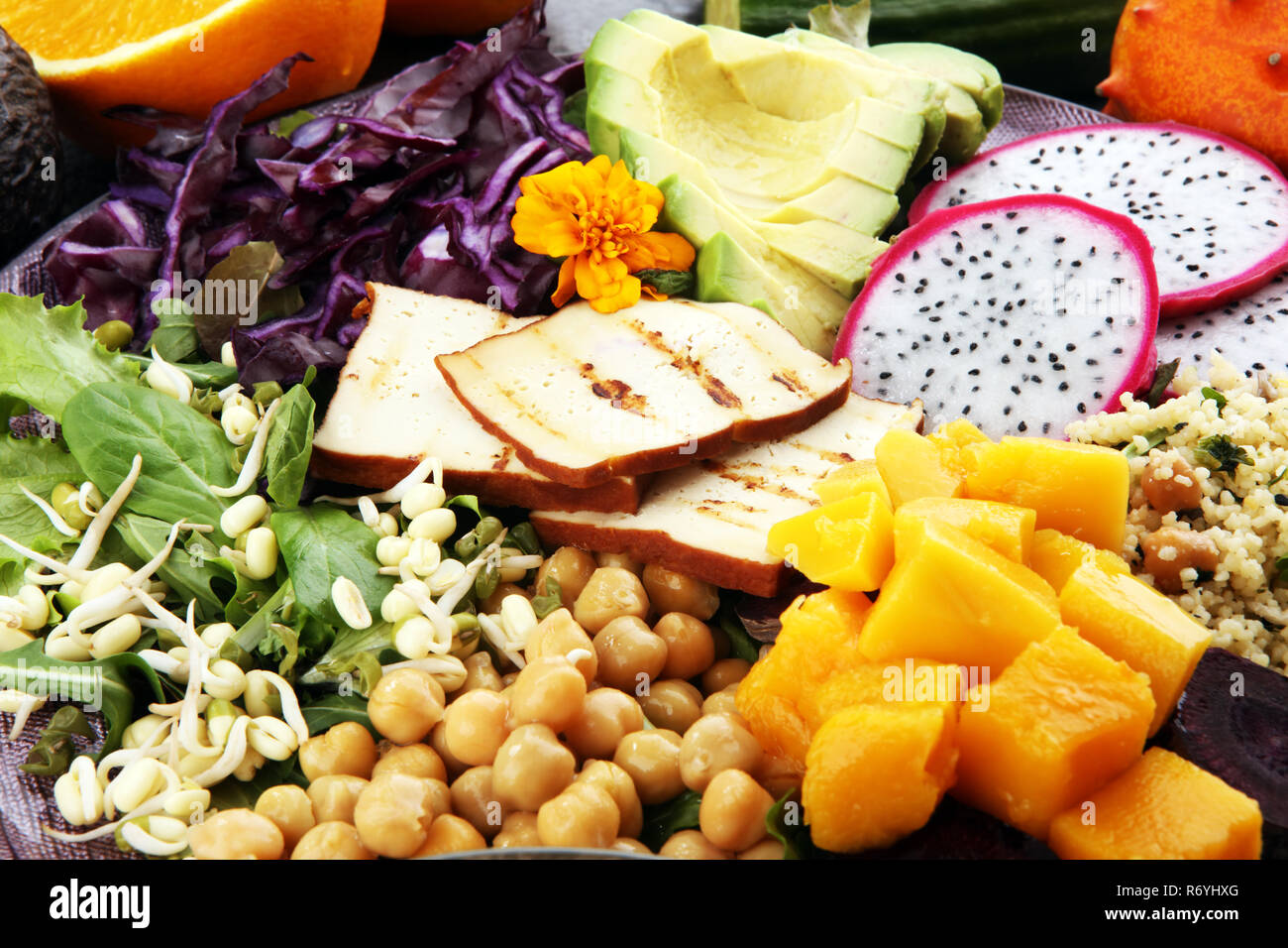 grilled tofu and dragon fruit buddha bowl with vegetable and humus ...