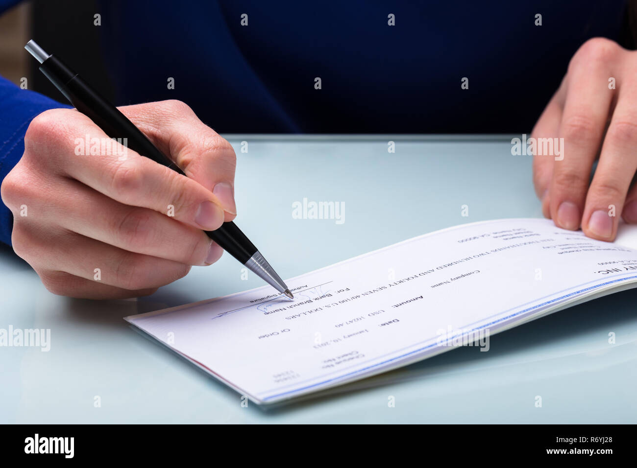 Cashier bank cheque hi-res stock photography and images - Alamy