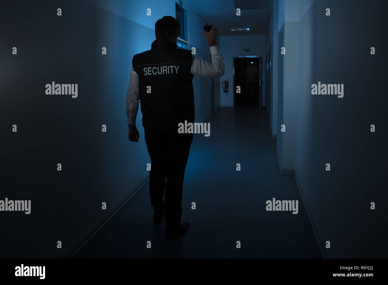 Security Guard Standing In Corridor Of The Building Stock Photo - Alamy