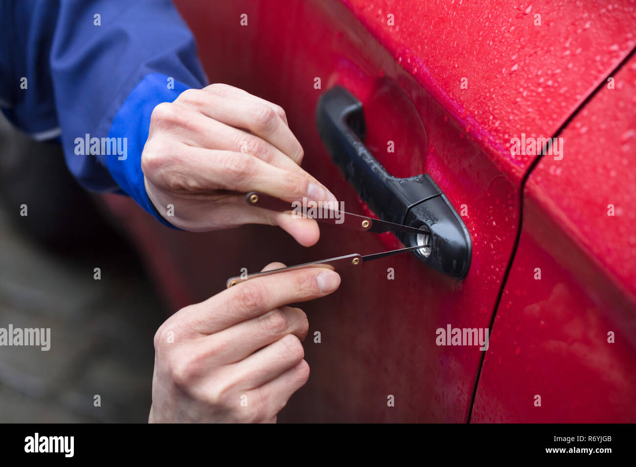 Person Opening Car Door With Lockpicker Stock Photo - Alamy