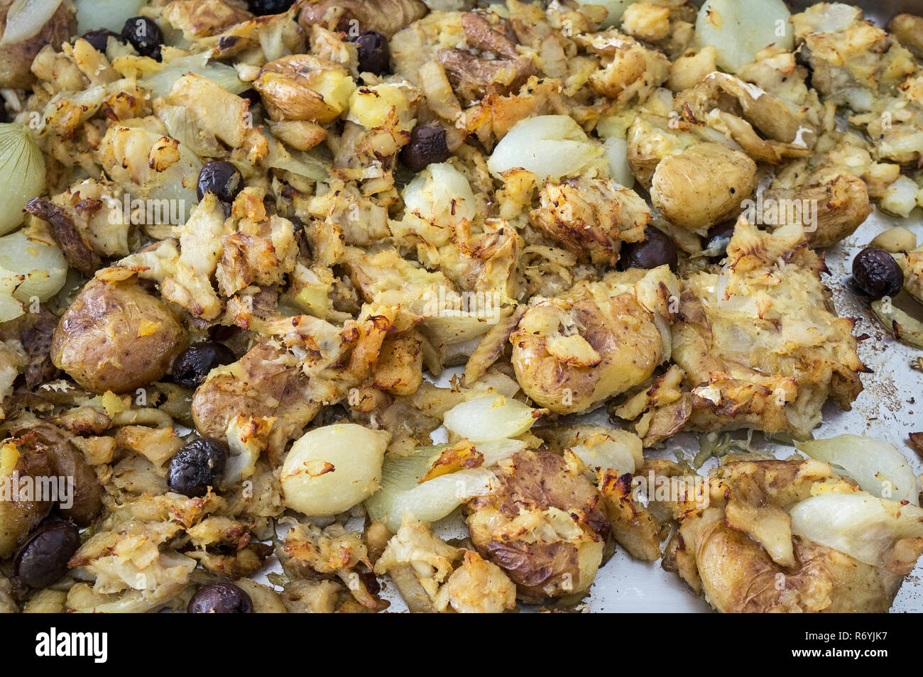 cod onion potato olives portuguese food traditional Stock Photo - Alamy