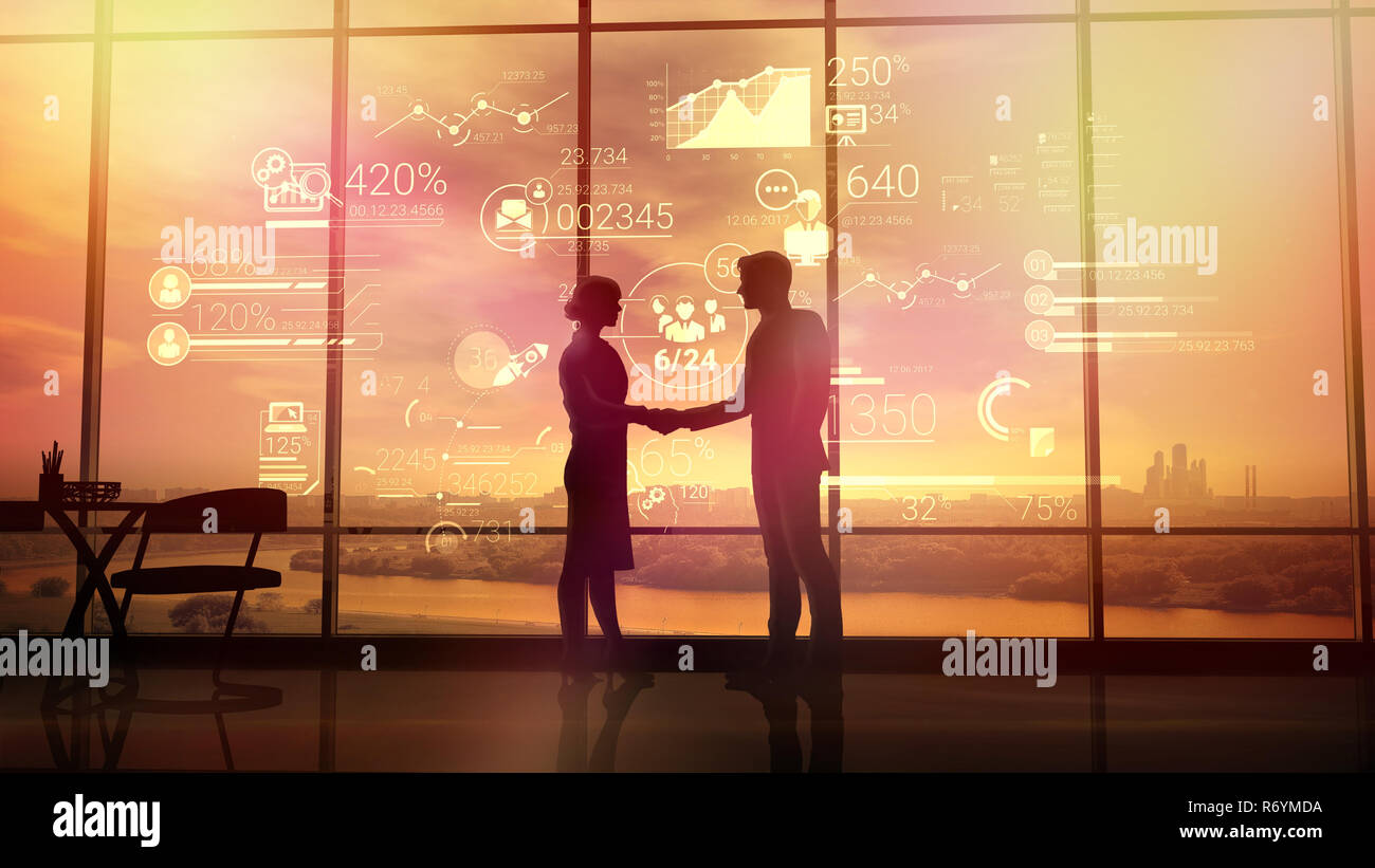 Business partners shake hands on the background of corporate ...