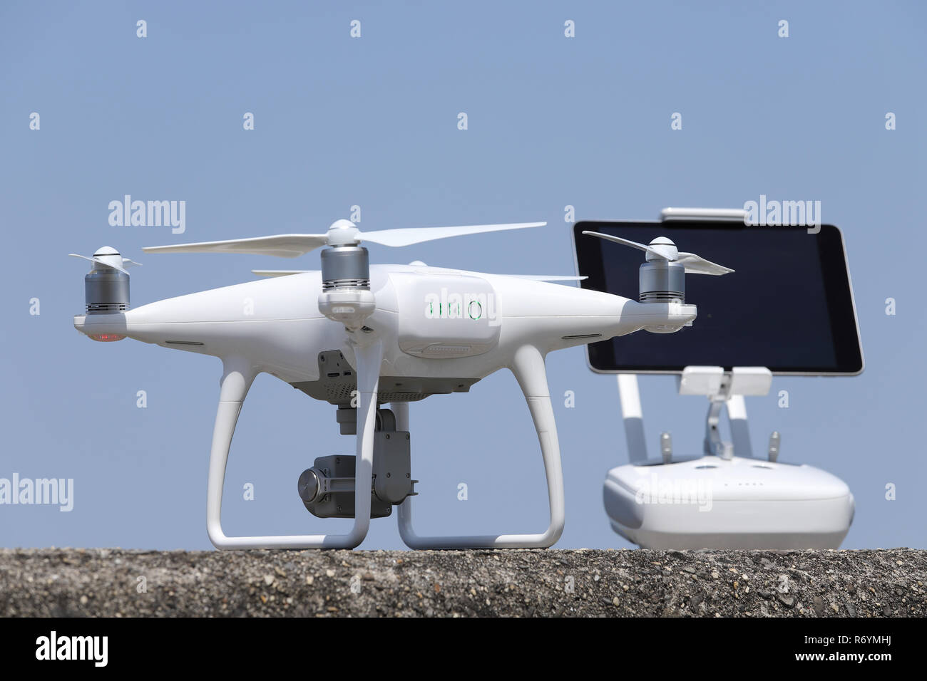 drone and remote controller, clear blue sky background Stock Photo - Alamy