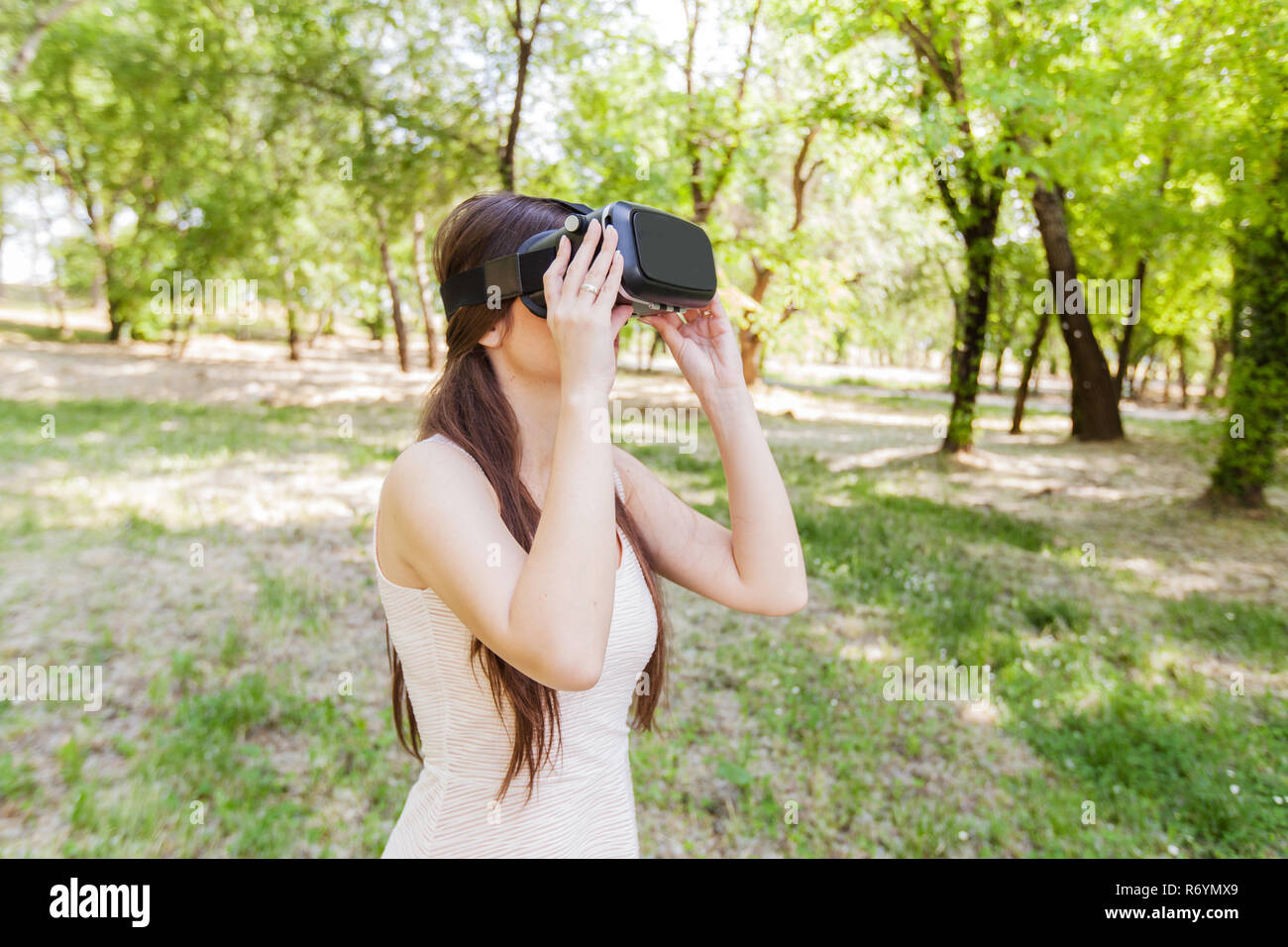 Woman wearing Virtual Reality Goggles Stock Photo - Alamy
