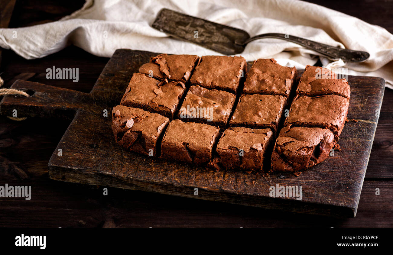 baked rectangular chocolate brownie pie is cut into squares Stock Photo ...
