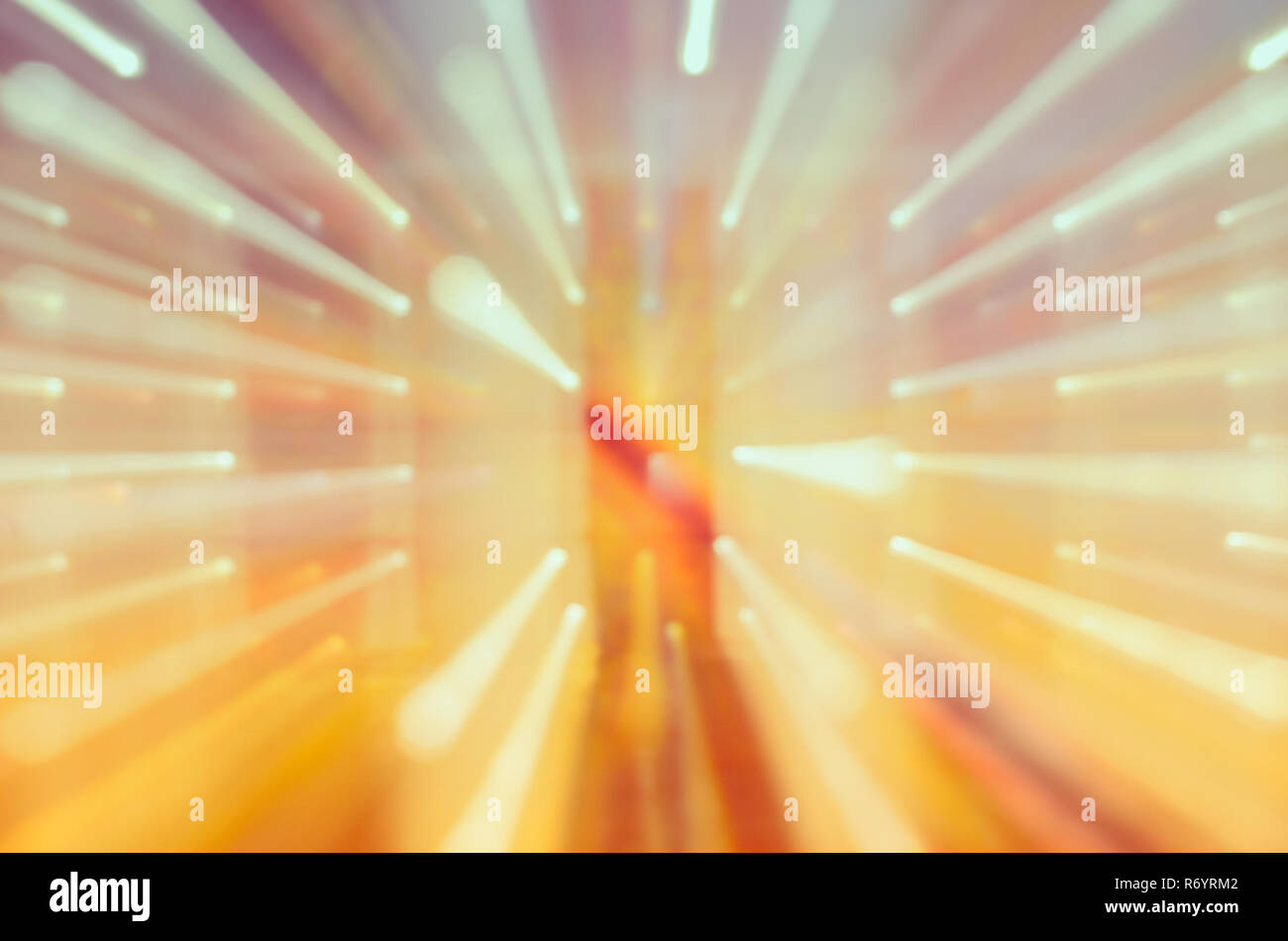 Abstract yellow blurred lights trail background using zoom technique ...