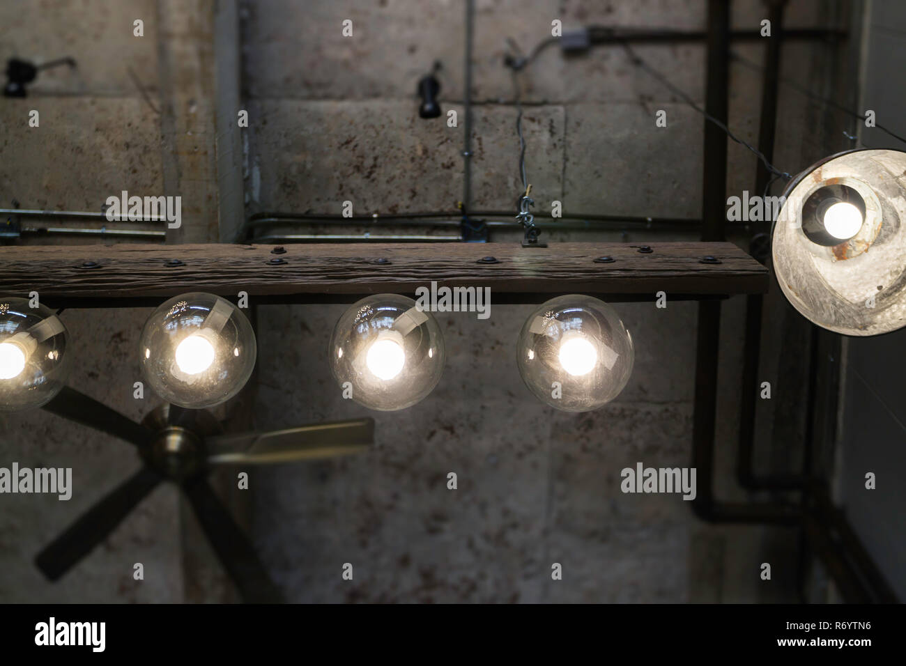 Light bulbs hanging from ceiling Stock Photo - Alamy