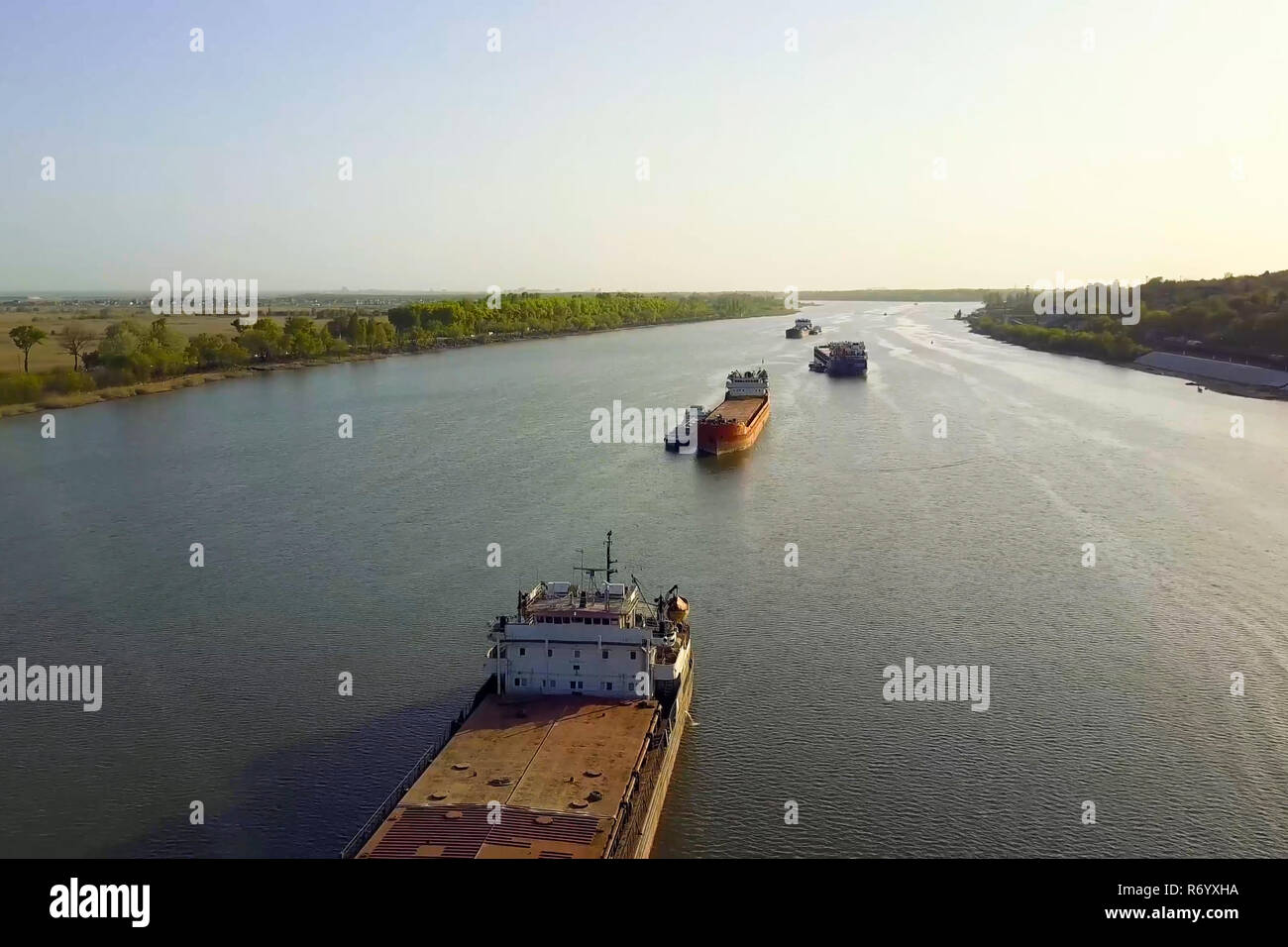 A cargo barge floats along the river. Cargo ship Stock Photo - Alamy