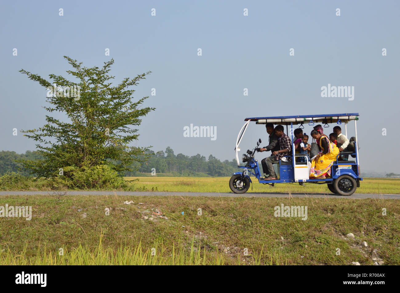Toto or Electric Rickshaw carrying the villagers at Mangalbari bustee ...