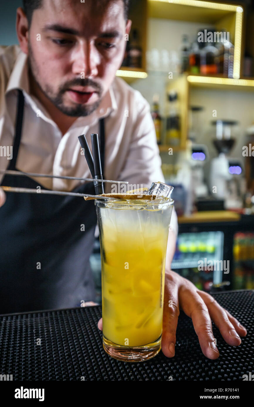 Bartender decorating a glass Stock Photo - Alamy