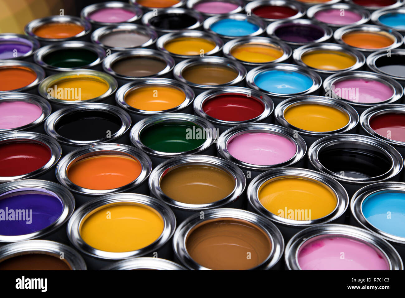 Buckets full of rainbow colored oil paint Stock Photo - Alamy