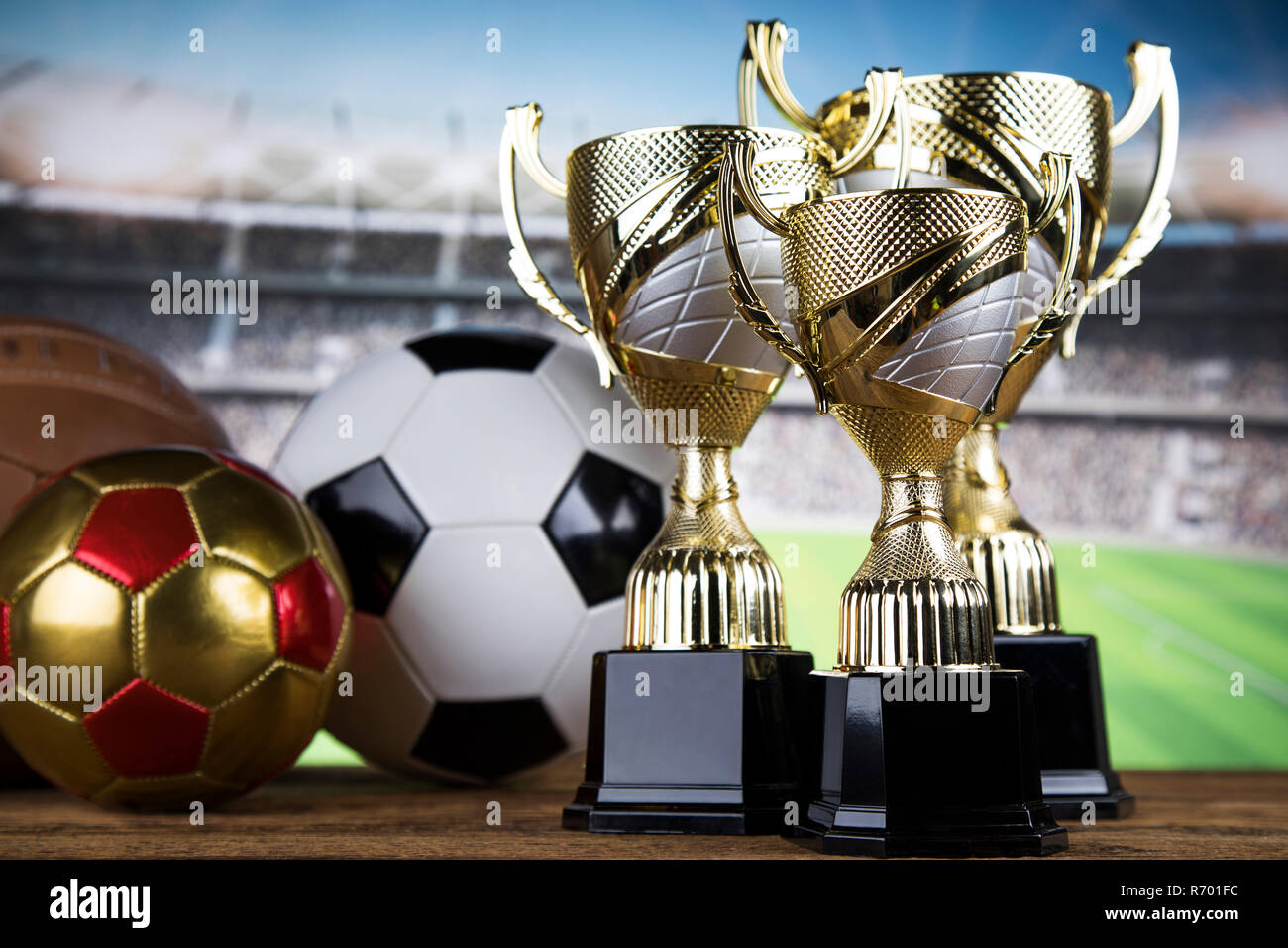 Winner trophy, Sport equipment and balls Stock Photo - Alamy