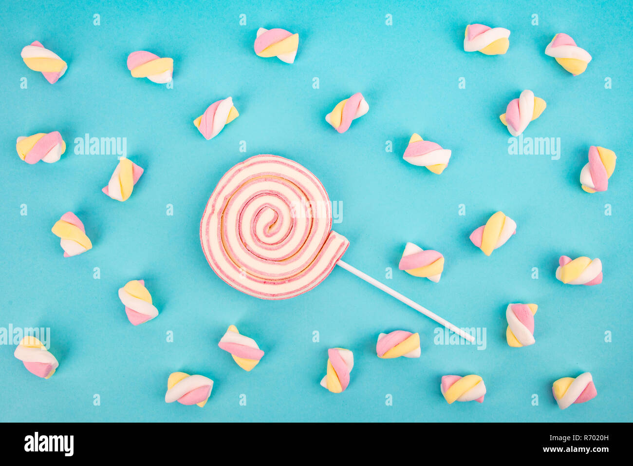 Sweet tasty marshmellows and Lollipop on light blue background Stock ...