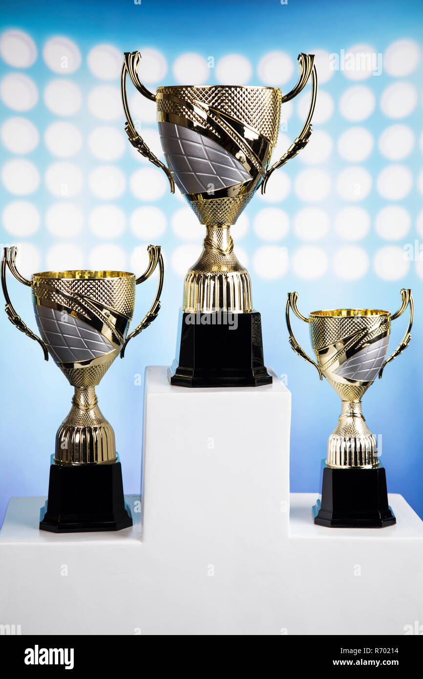 Sport podium, Cups of winners award Stock Photo - Alamy