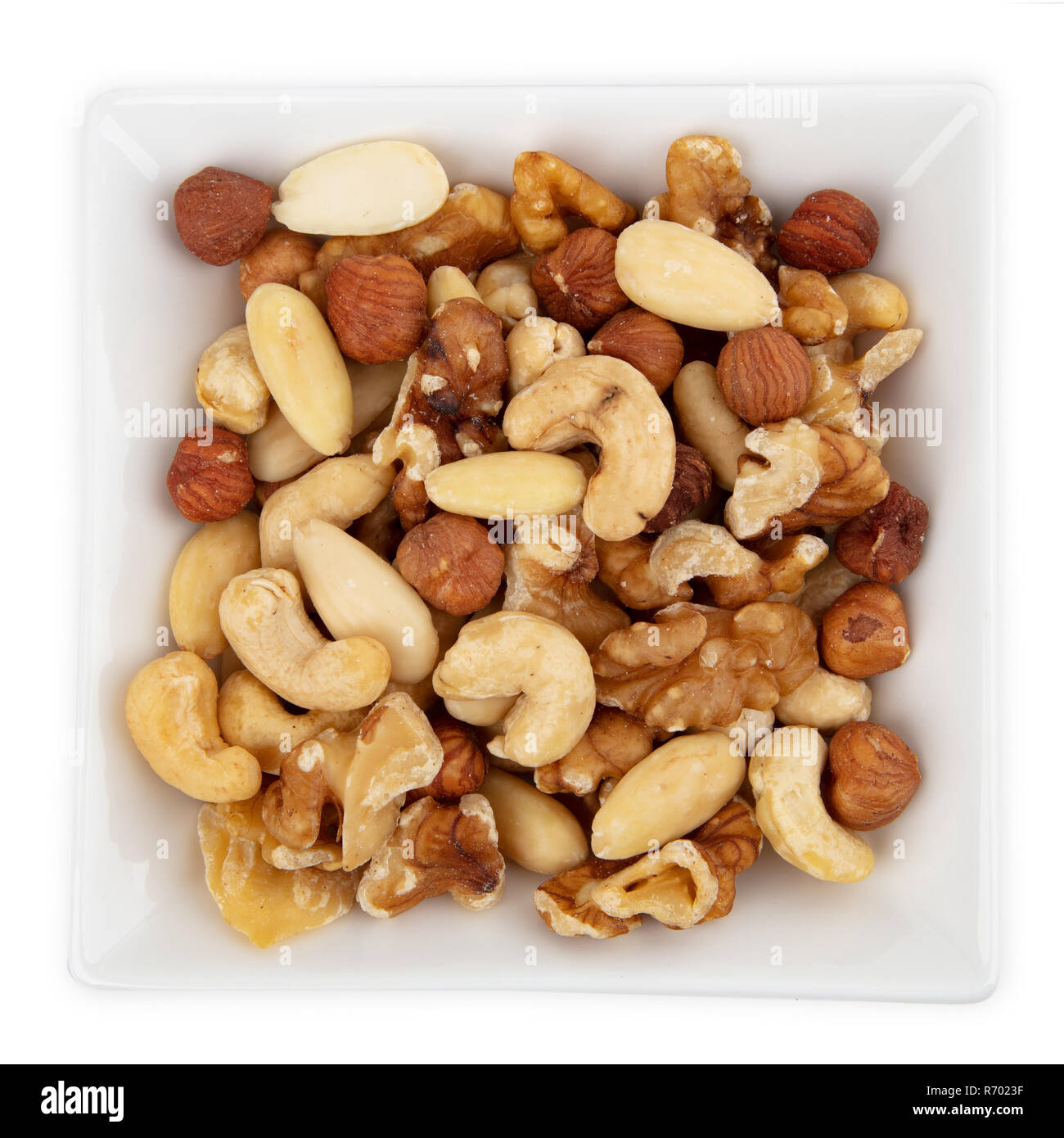 Variety of tasty nuts in a bowl isolated on white background Stock ...