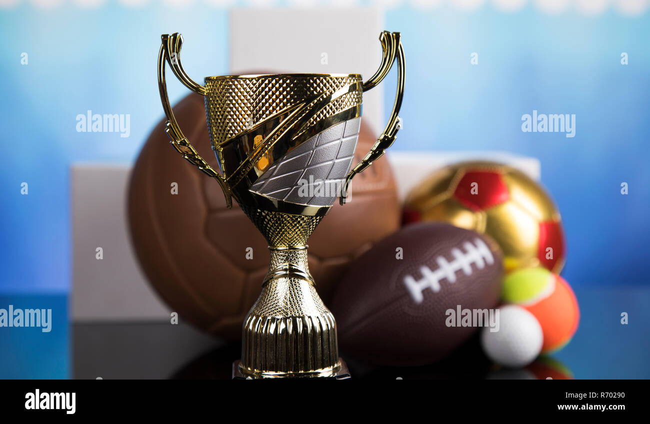 Winner trophy, Sport equipment and balls Stock Photo - Alamy
