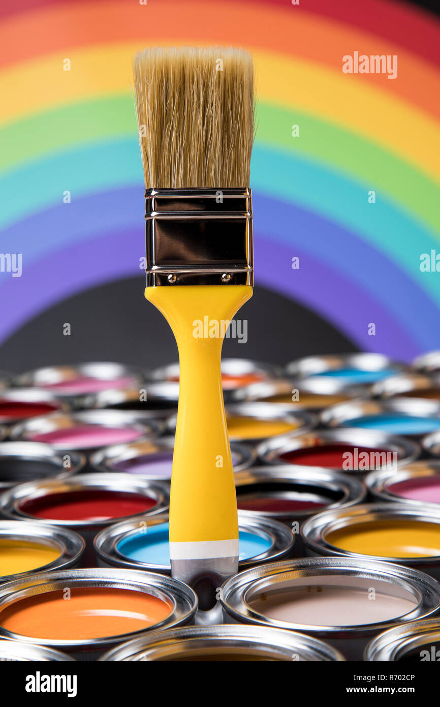 Open paint cans with a brush, Rainbow colors Stock Photo - Alamy