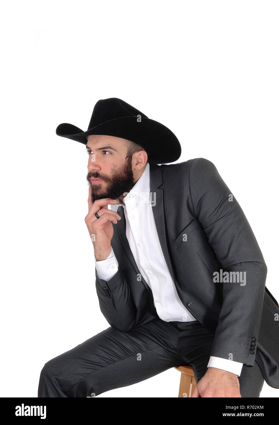 Portrait of man in a suit and cowboy hat Stock Photo - Alamy