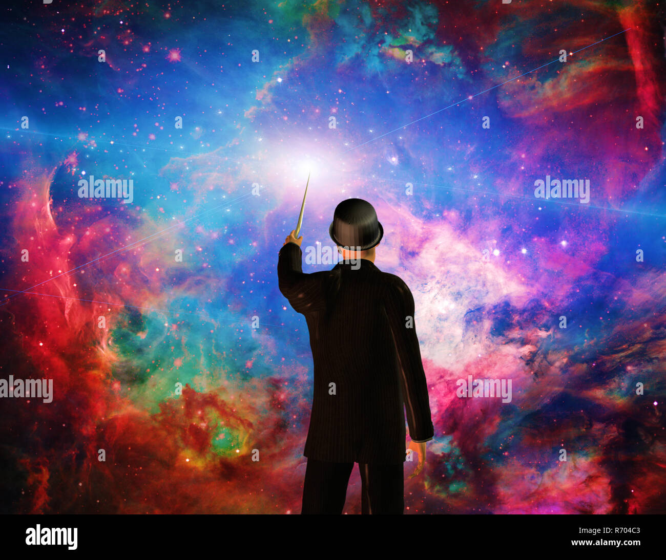 Man in suit with magic wand creates universe Stock Photo - Alamy