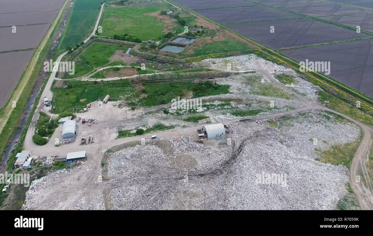garbage dump with heaps of garbage and treatment facilities. Landfill ...