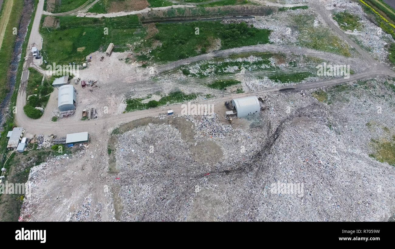 garbage dump with heaps of garbage and treatment facilities. Landfill ...