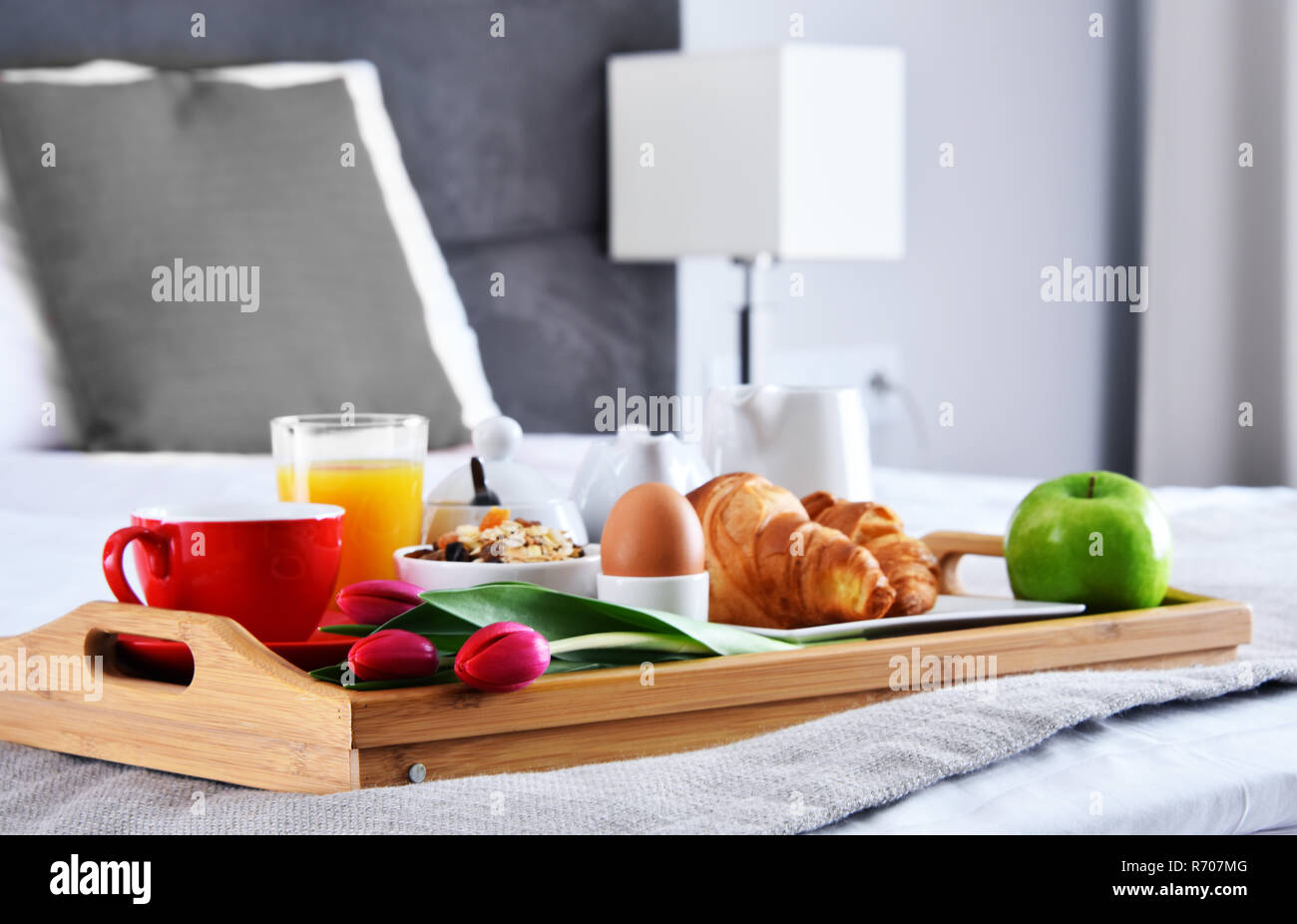 Breakfast on tray in bed in hotel room Stock Photo - Alamy