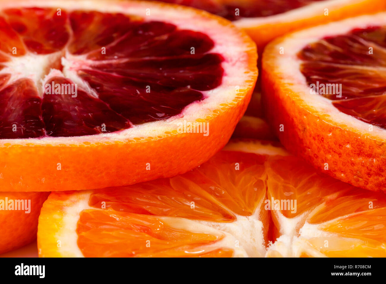 Background from slices of red orange slices, close up Stock Photo - Alamy