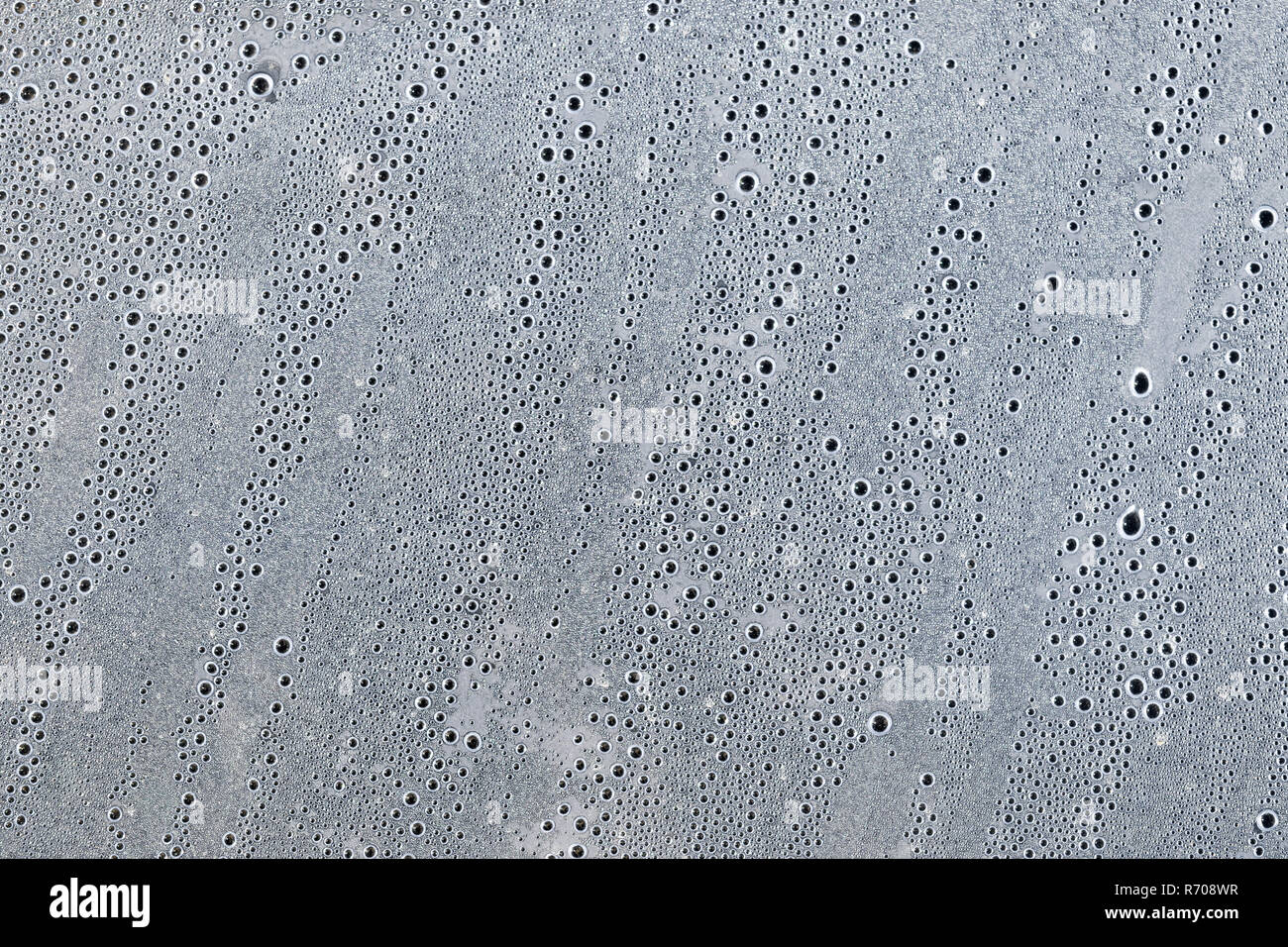 Background of the condensate drops on the film is polyethylene. Water ...