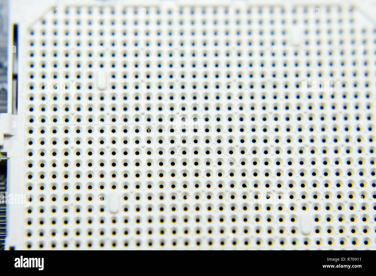 A socket under the processor of the computer, holes under the feet of ...