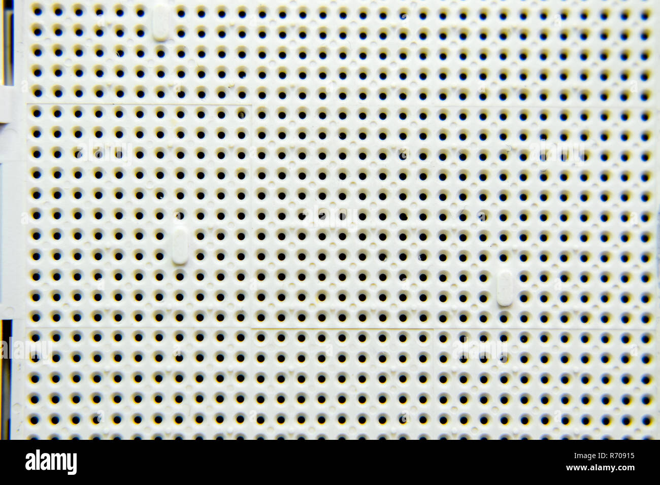 A socket under the processor of the computer, holes under the feet of ...