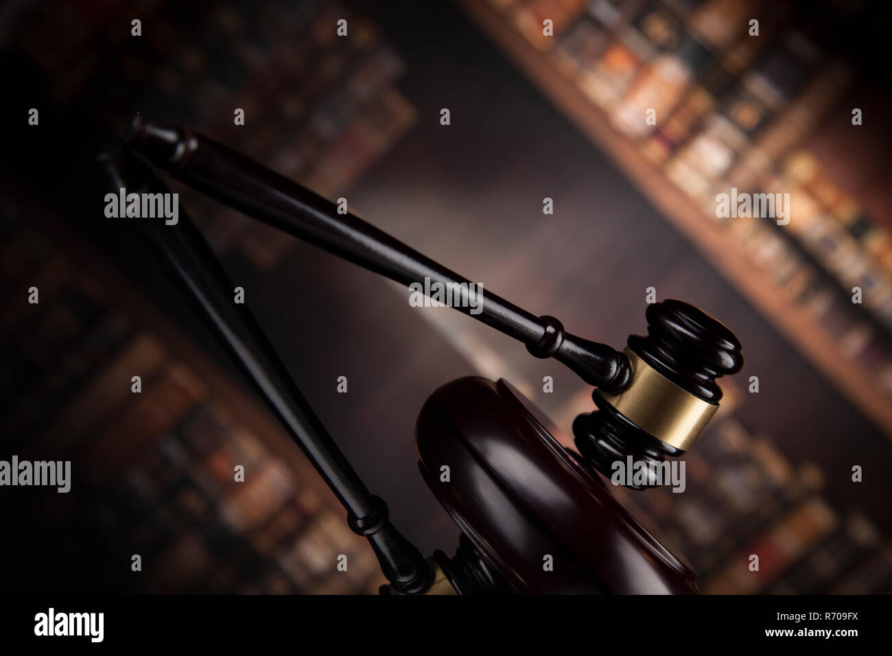 Law books, mallet of the judge, Courtroom background Stock Photo - Alamy