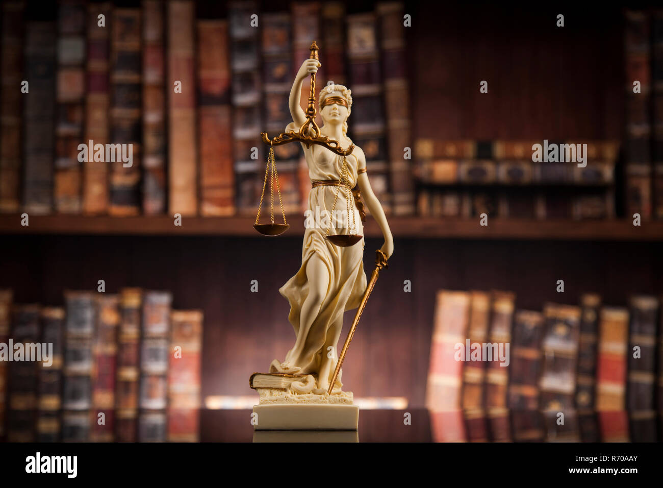 Antique statue of justice, law, books background Stock Photo - Alamy