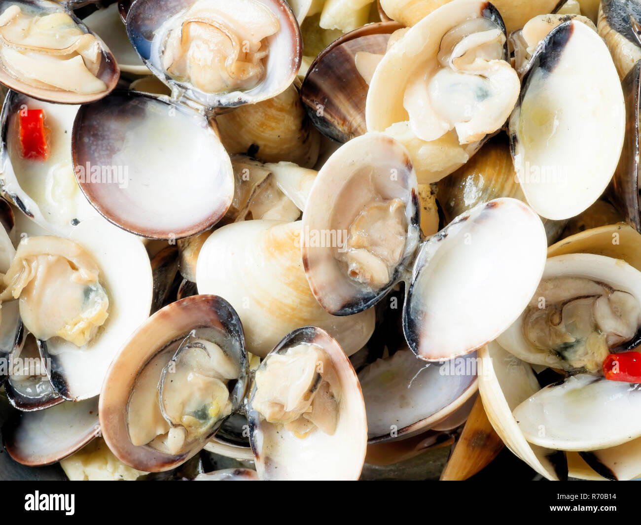 rustic italian vongole clams in white wine sauce food background Stock ...