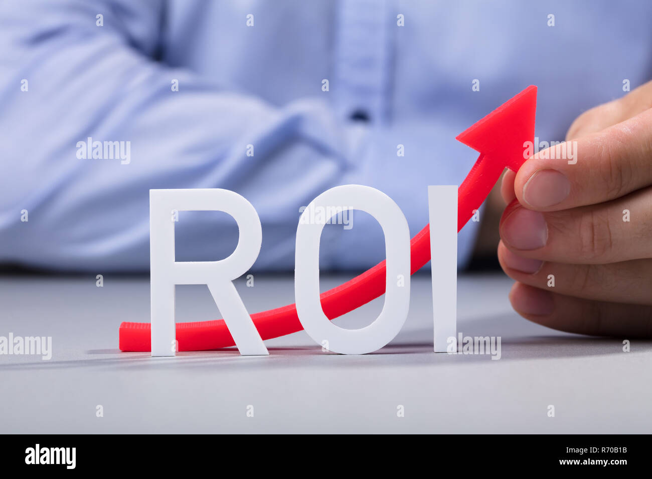 Red Increasing Return On Investment Arrow Stock Photo - Alamy