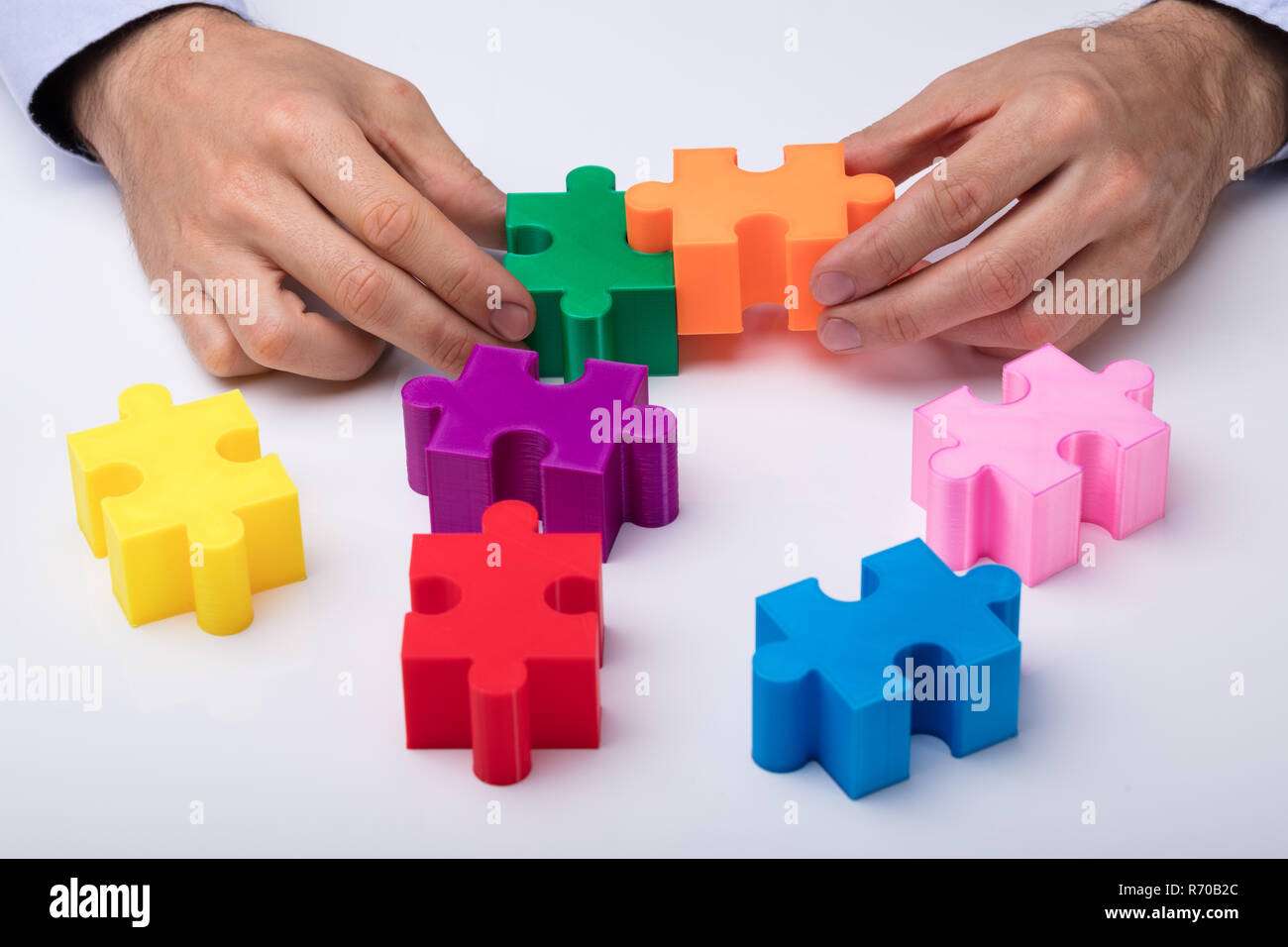 Persons hand holding pieces hi-res stock photography and images - Alamy