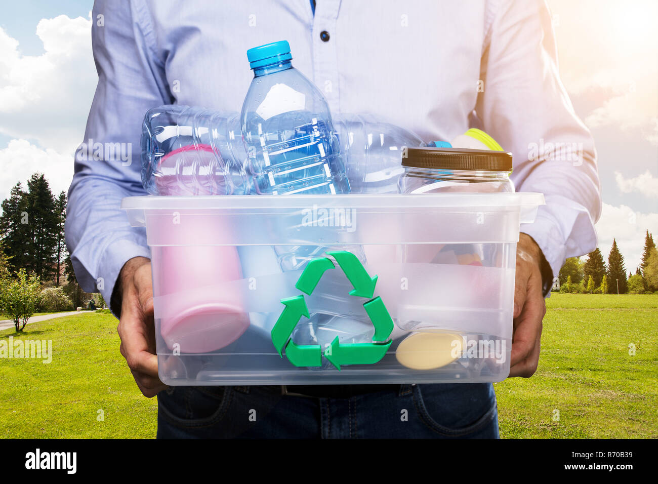 Man carrying plastic containers hi-res stock photography and images - Alamy