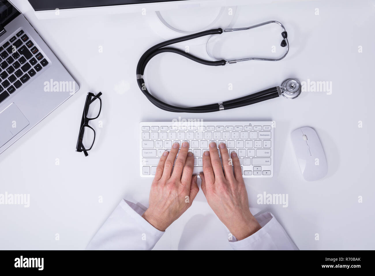 Elevated View Of A Doctor's Hand Typing On Computer Keyboard Stock ...